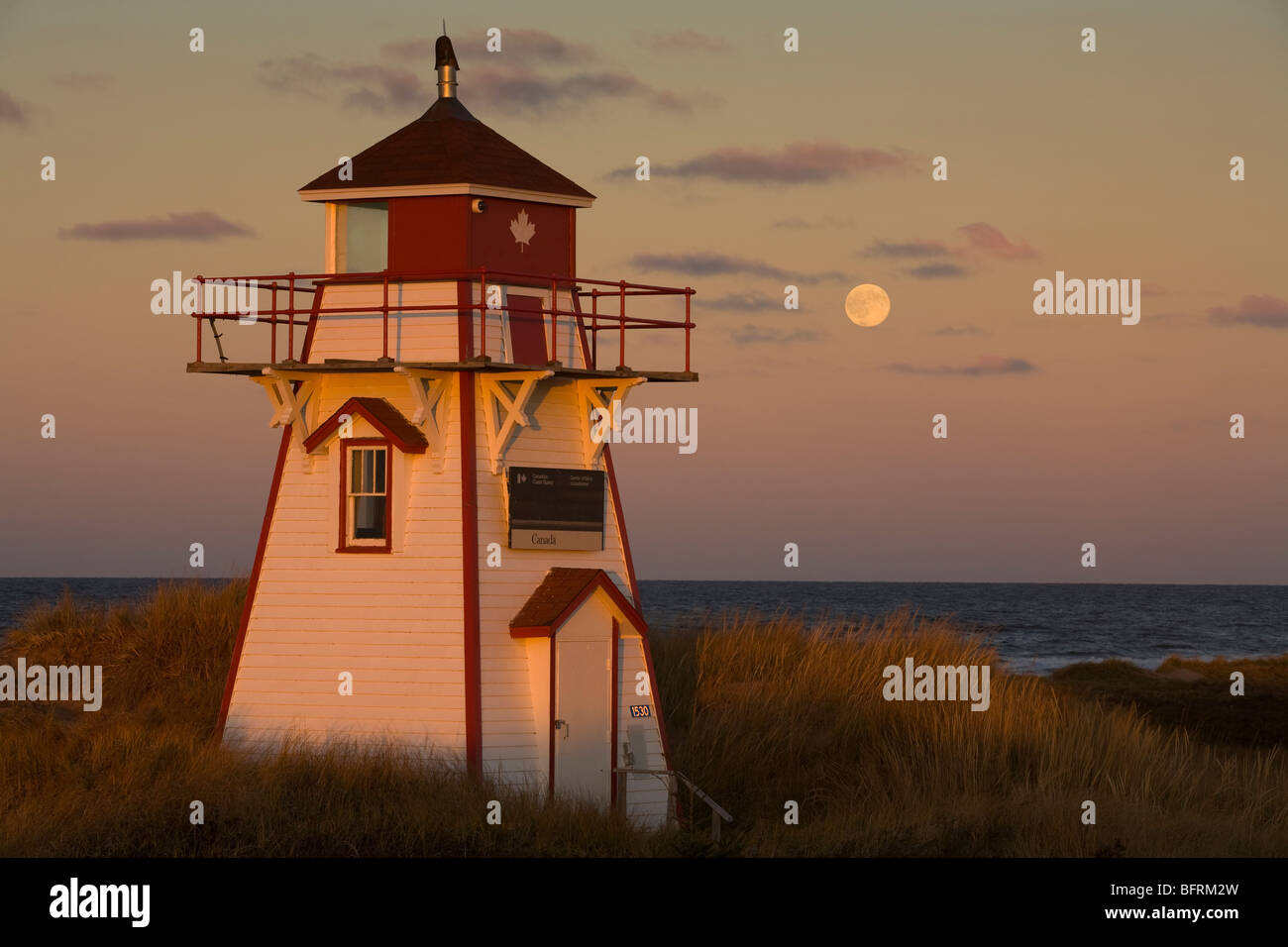full moon over Covehead lighthouse, Prince Edward Island National Park ...