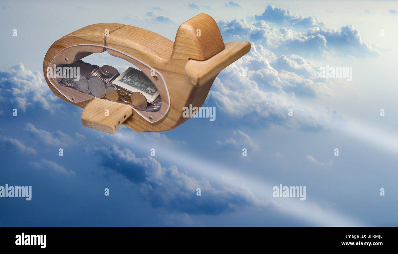 Money in flight in wooden airplane Stock Photo - Alamy