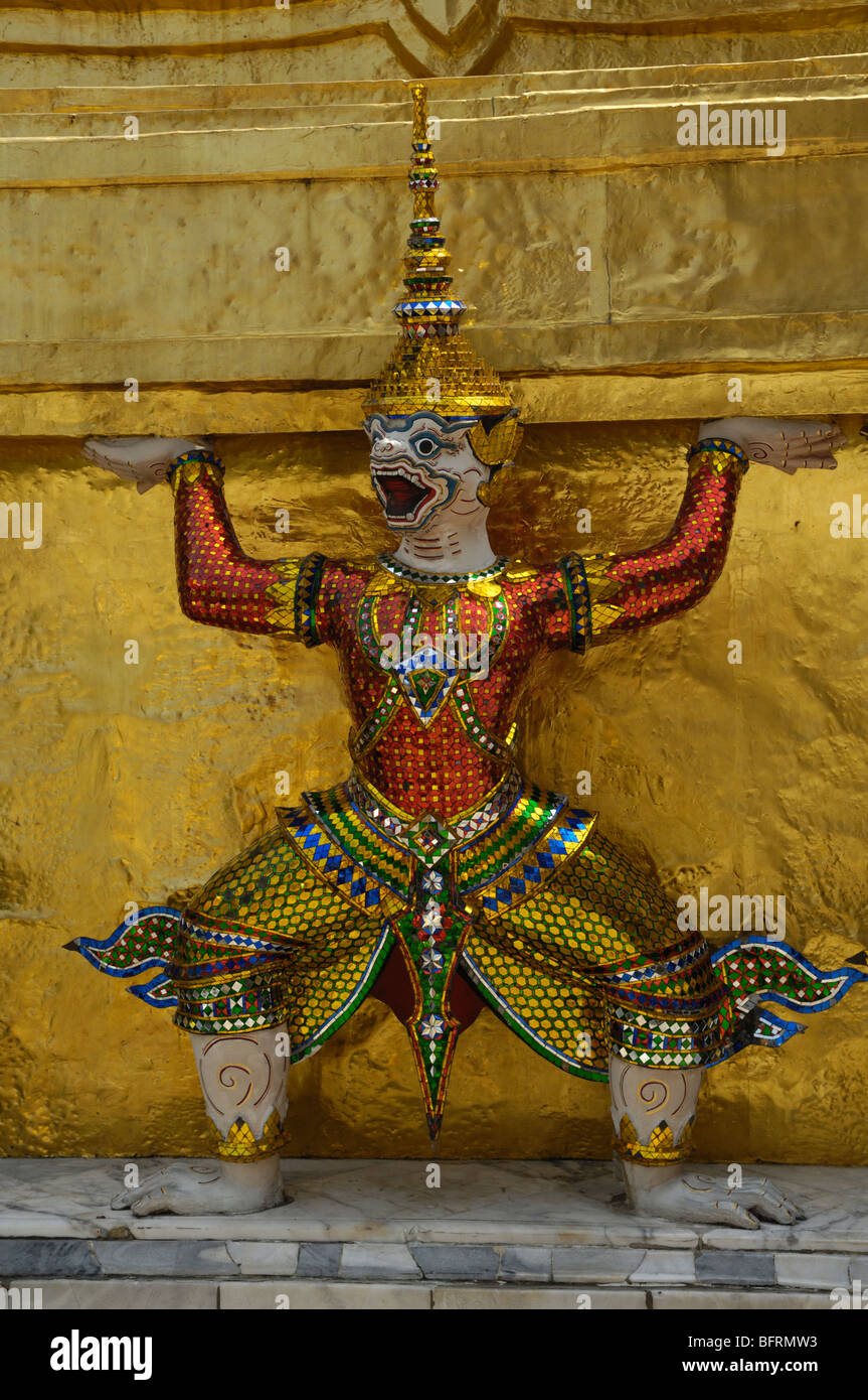 Yaksha demon guardian supporting golden chedi Stock Photo - Alamy