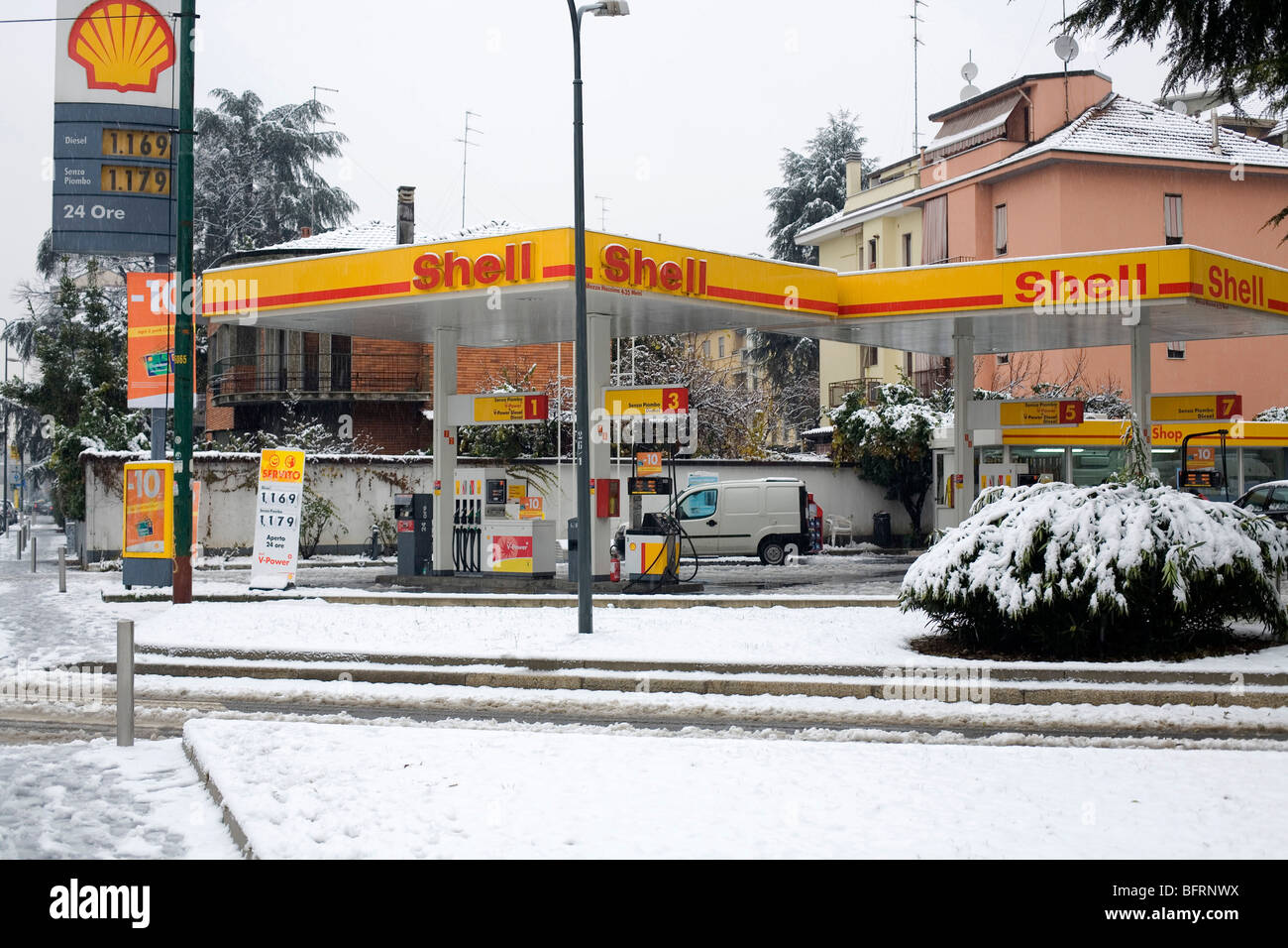 Gas station in snow Milan Italy Stock Photo - Alamy