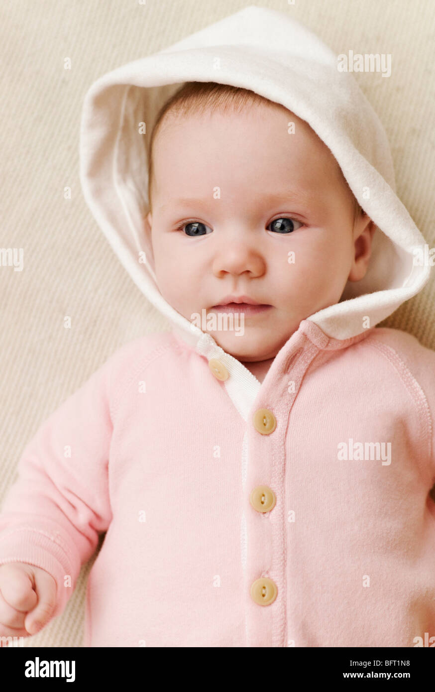 Baby Wearing Hooded Outfit Stock Photo - Alamy