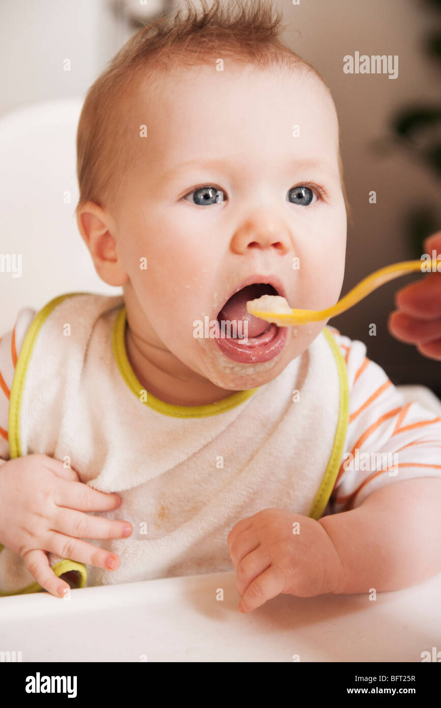 Parent Feeding Baby Stock Photo - Alamy