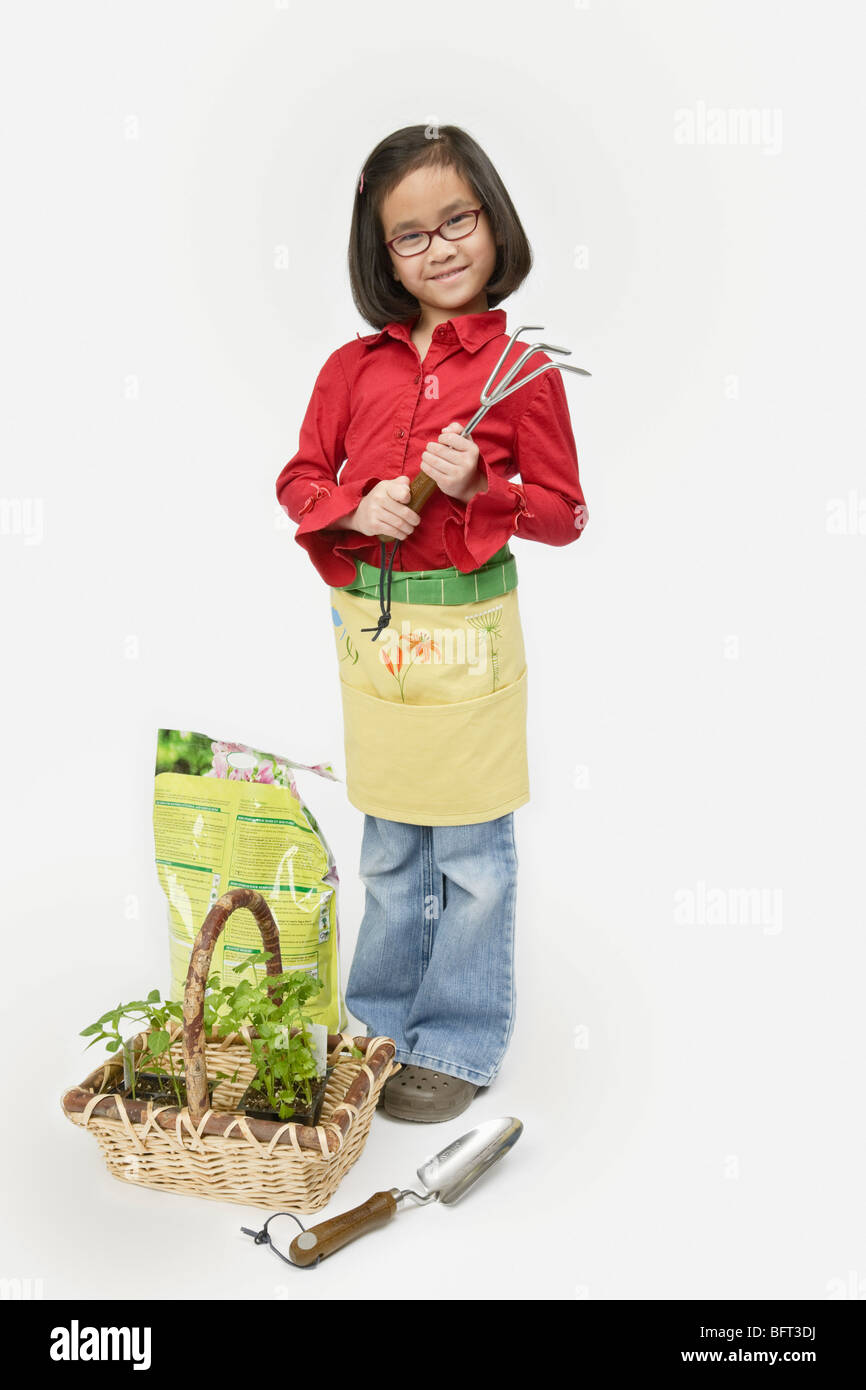 Girl with Gardening Tools Stock Photo - Alamy