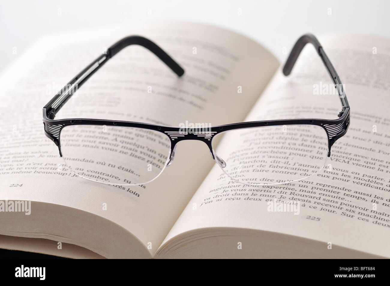 Reading Glasses on Book Stock Photo - Alamy