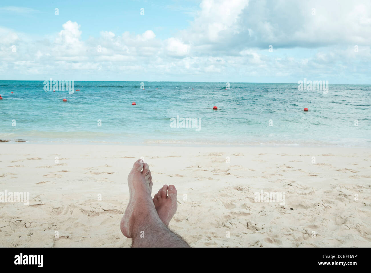 Man Lounging on the Beach, Turks and Caicos Stock Photo - Alamy