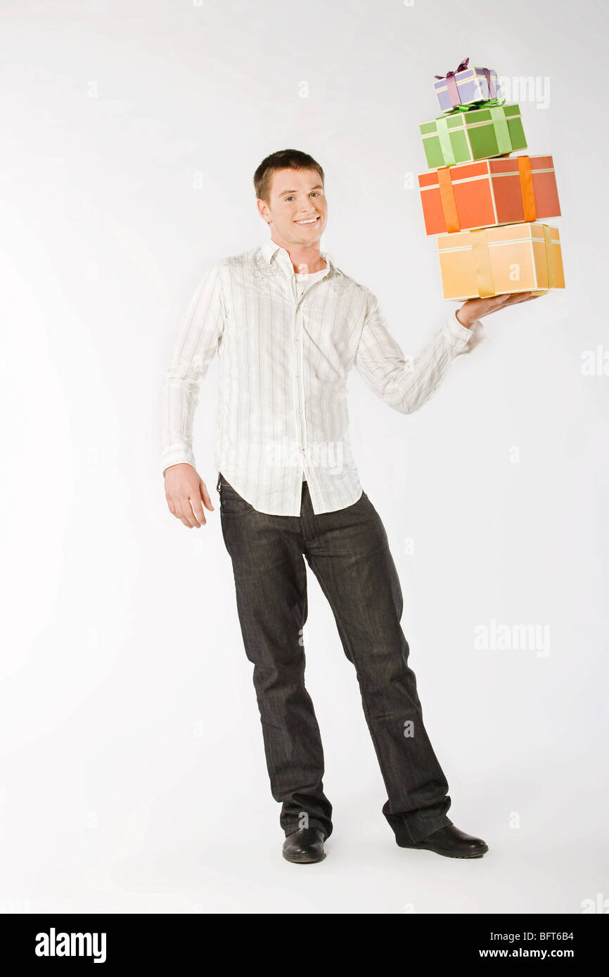 Man Holding Gifts Stock Photo - Alamy