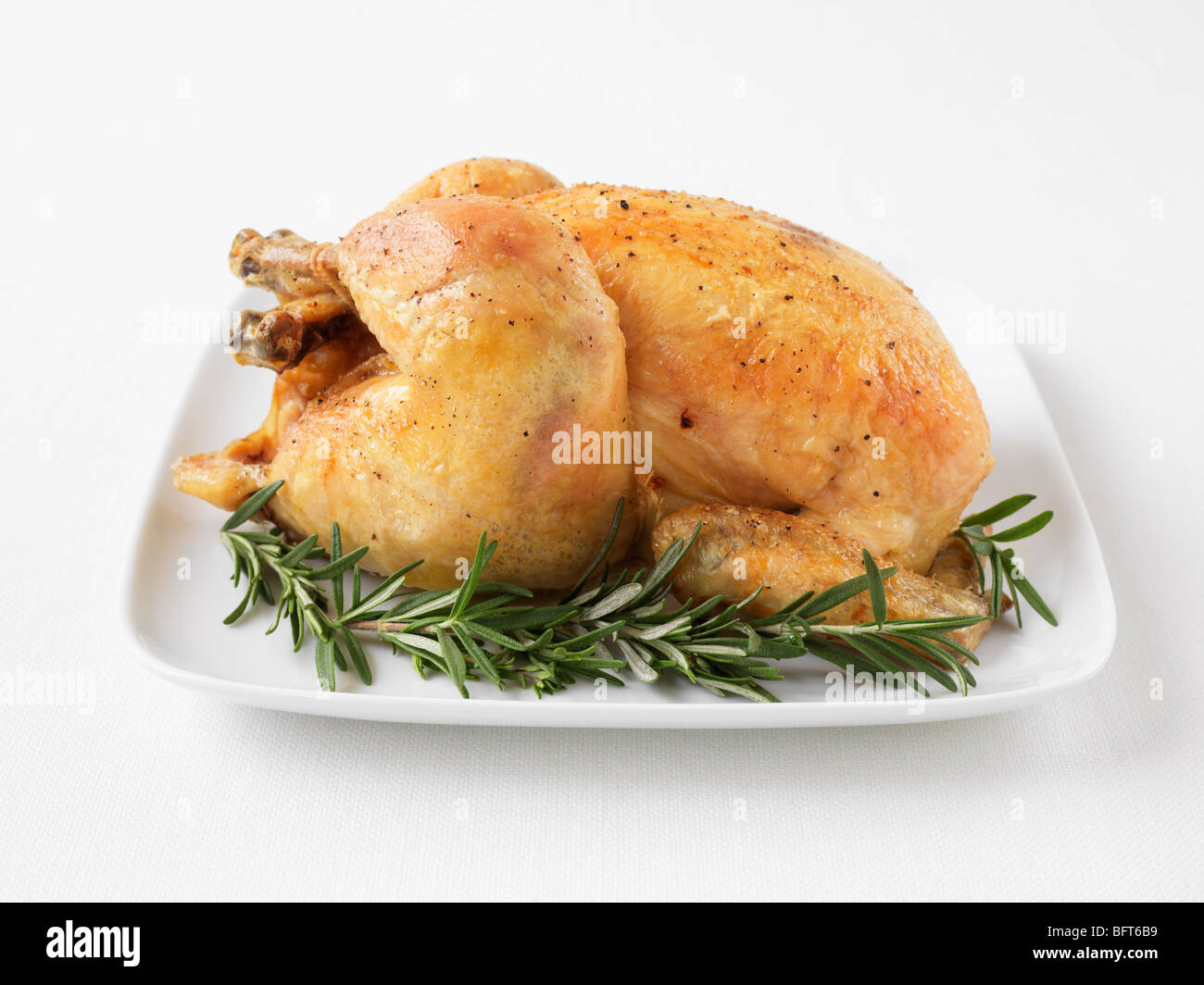 Roast Chicken on Platter With Rosemary Garnish Stock Photo - Alamy