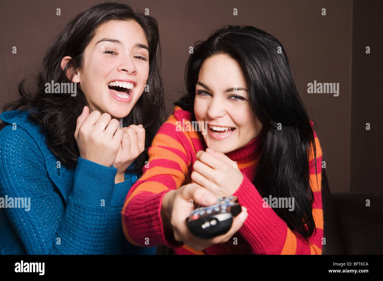 Women with Remote Control Stock Photo - Alamy