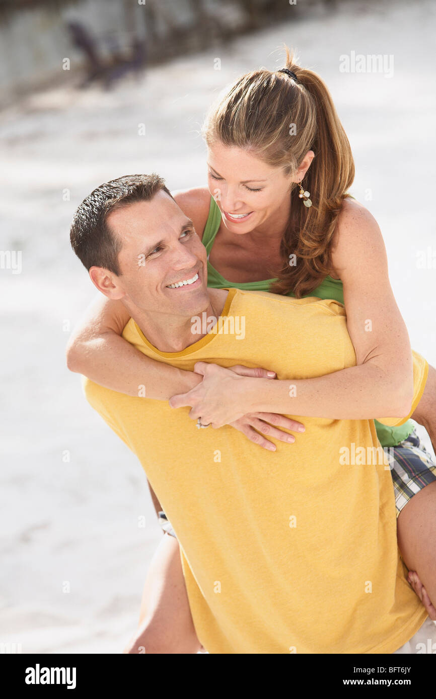 Two men carry woman look hi-res stock photography and images - Alamy