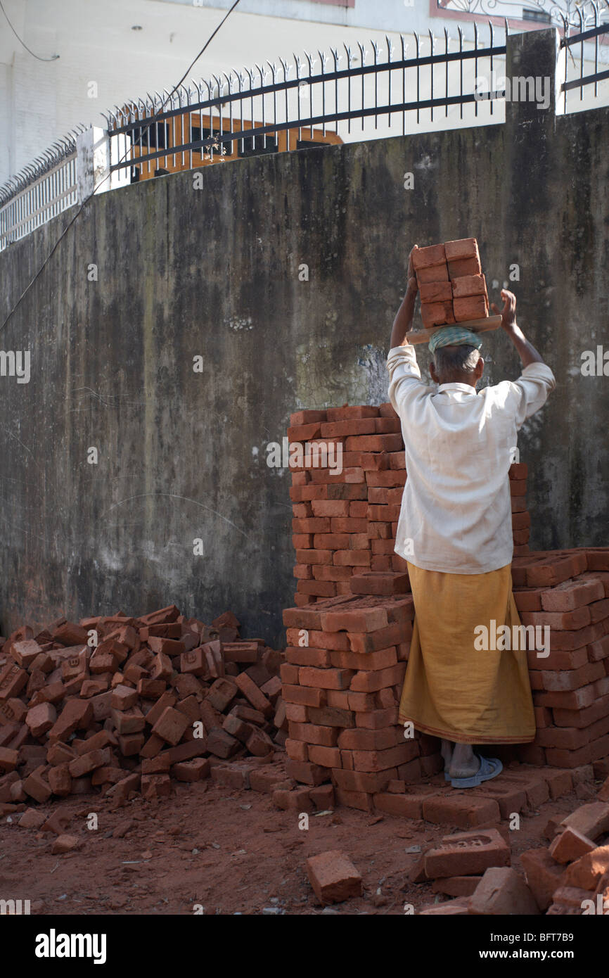 Man Stacking Bricks, Rishikesh, Uttarakhand, India Stock Photo - Alamy