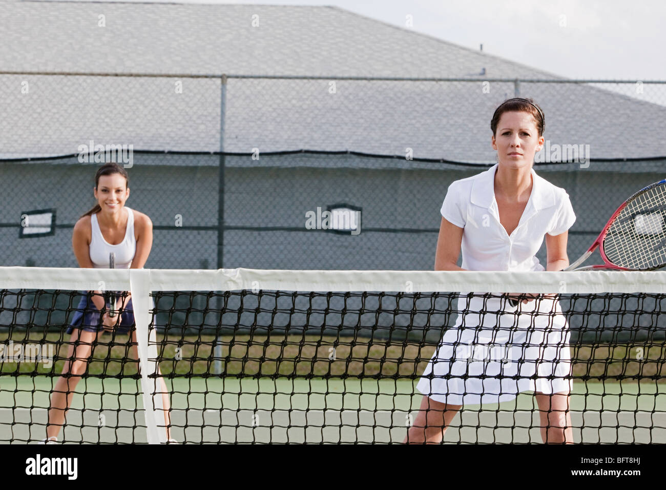 Two women playing tennis hi-res stock photography and images - Alamy