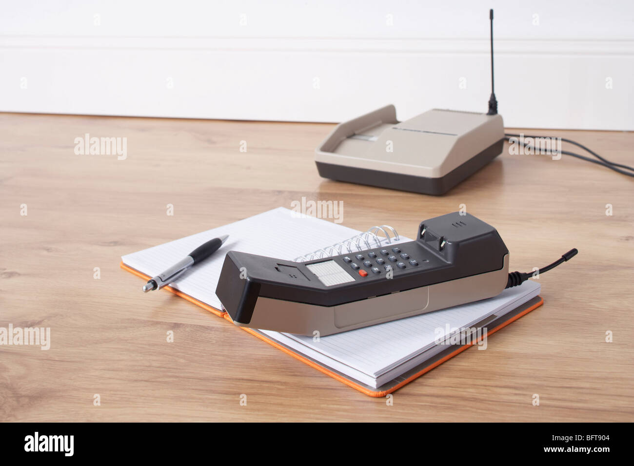 Cordless Phone on Notebook Stock Photo - Alamy