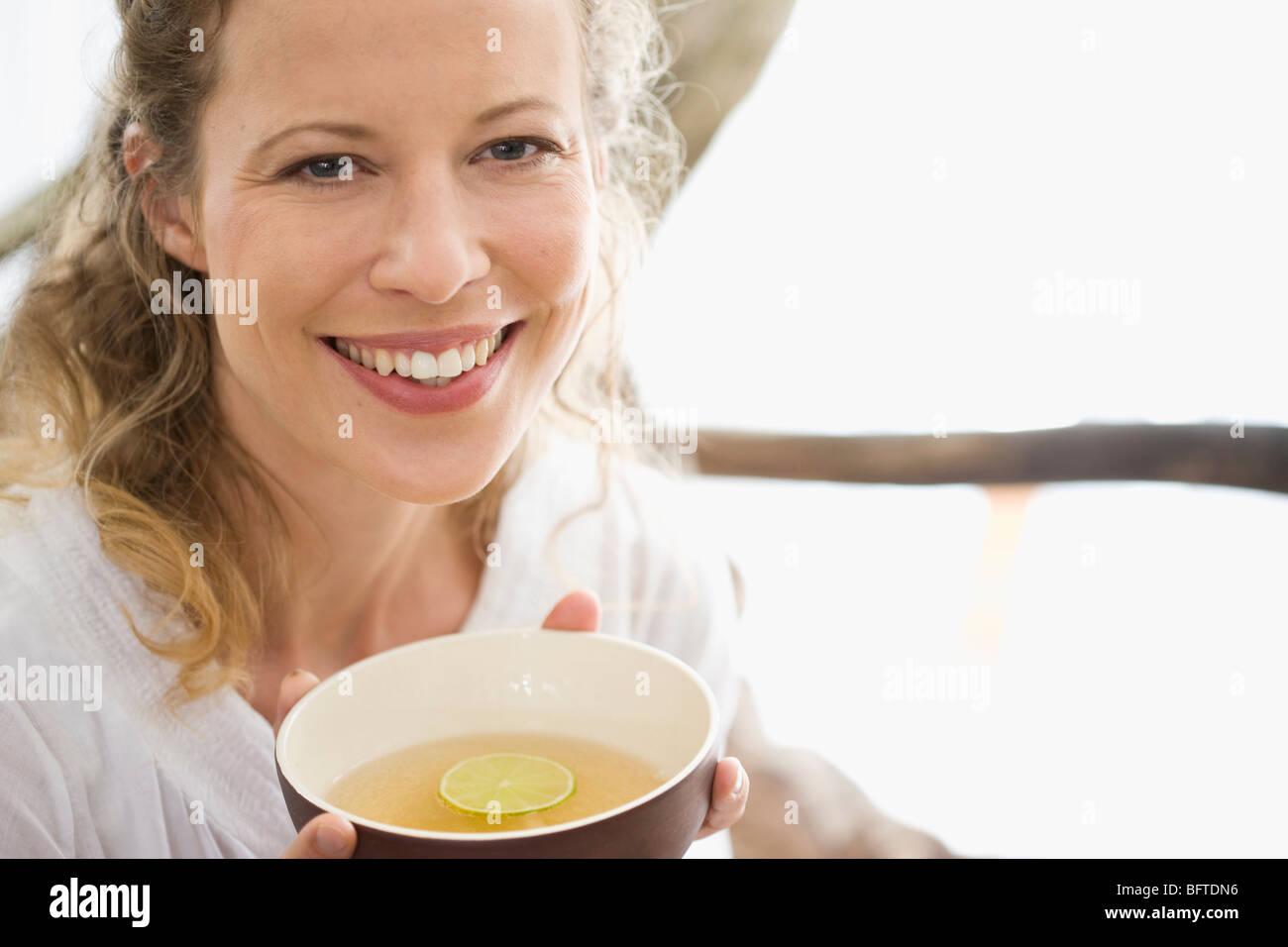 middle-aged woman drinking tea Stock Photo - Alamy