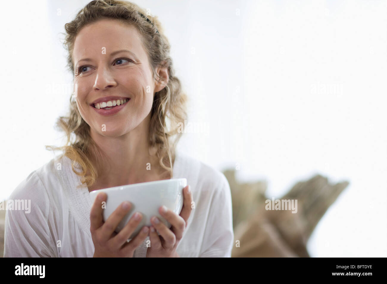 middle-aged woman drinking tea Stock Photo - Alamy