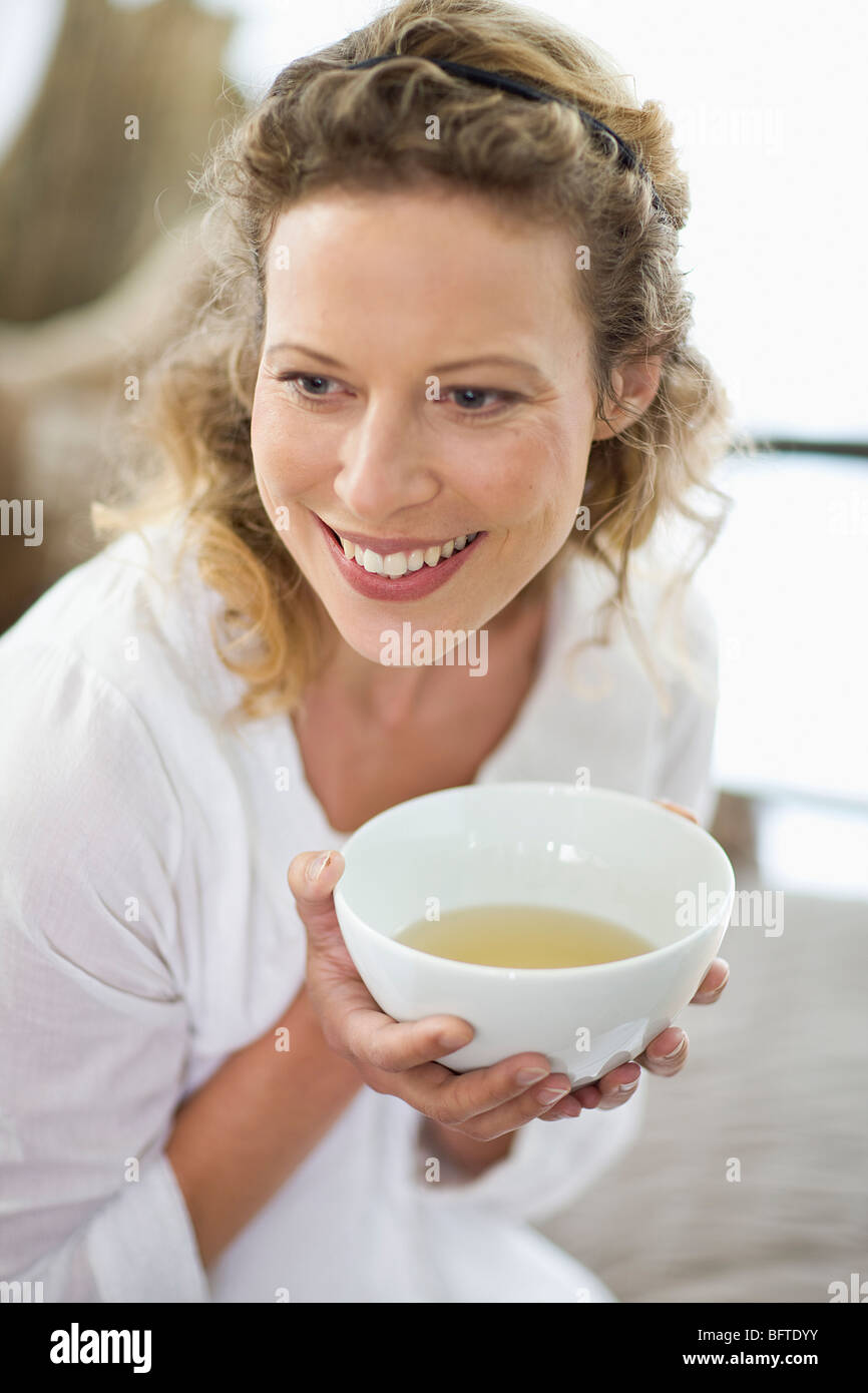 middle-aged woman drinking tea Stock Photo - Alamy