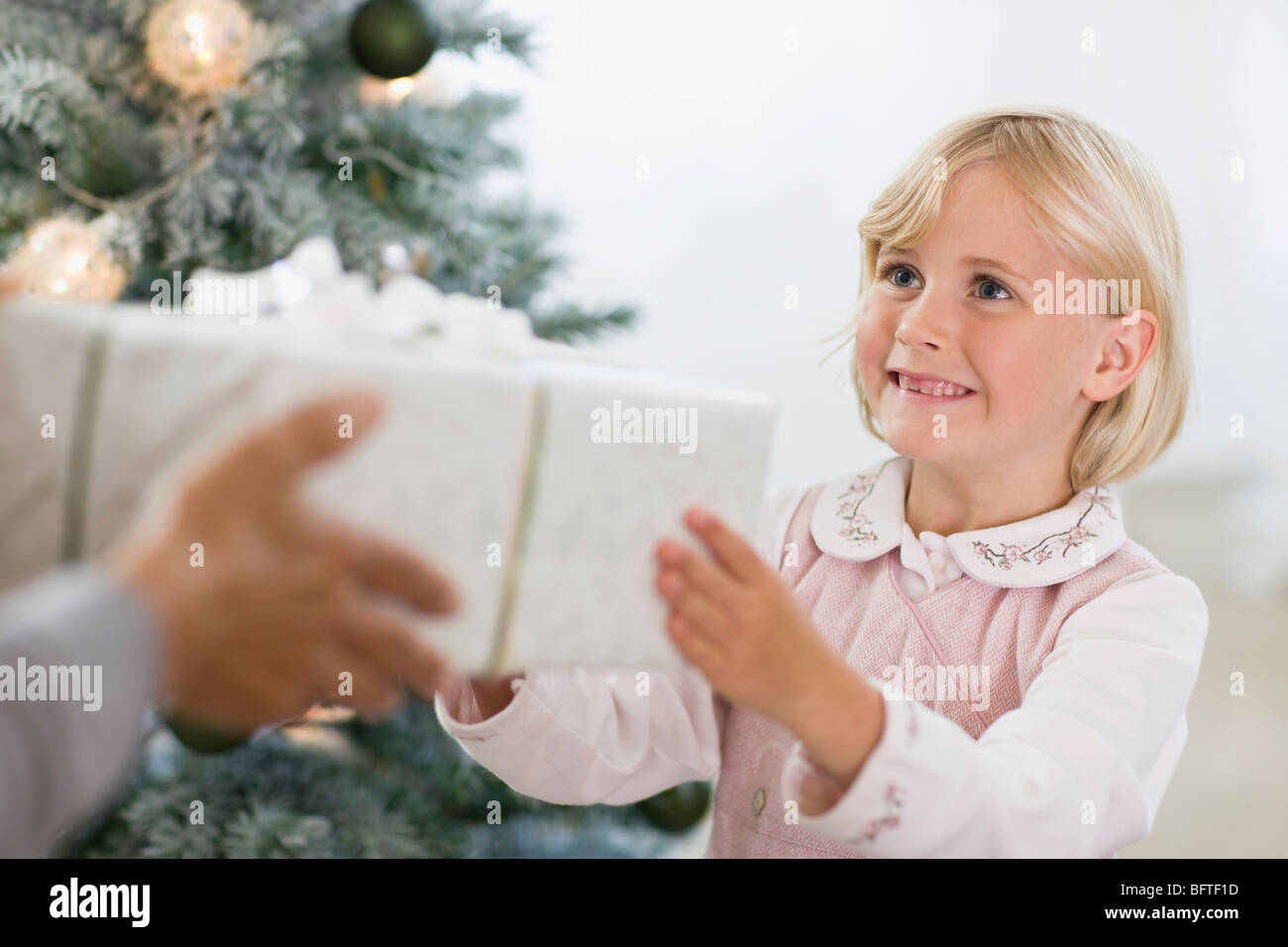 little girl getting a present Stock Photo - Alamy