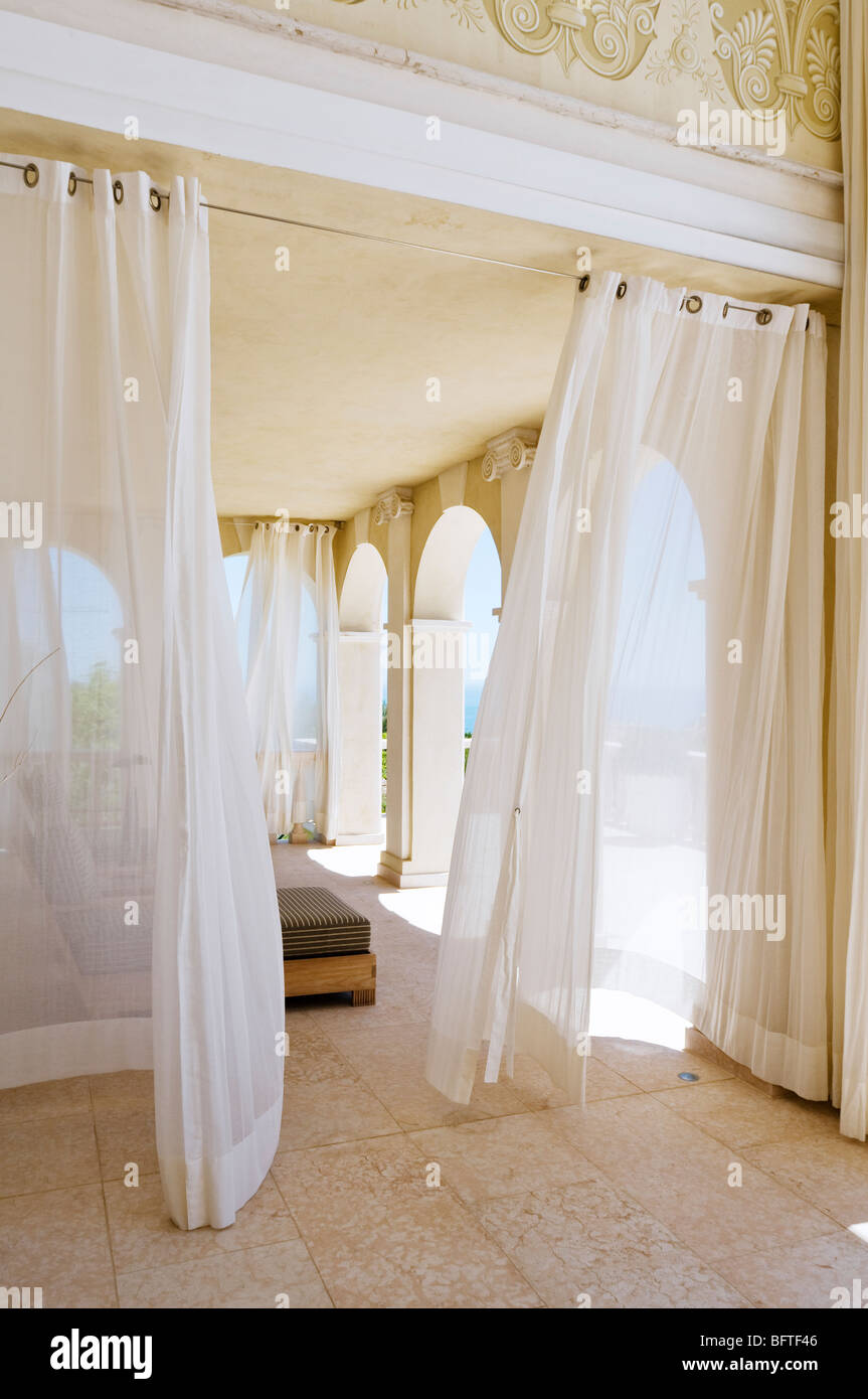 Veranda with arches in Spanish villa with architecture by Charlie ...