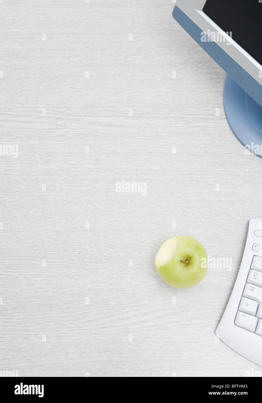 apple on desk Stock Photo - Alamy