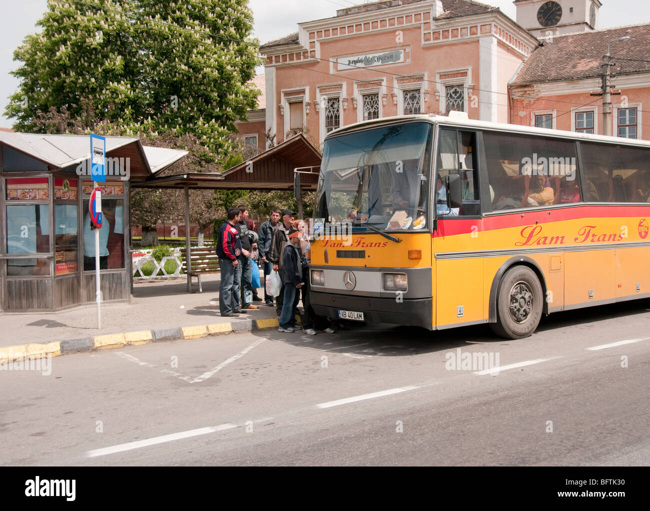 People queuing at bus stop in Sebes Romania Eastern Europe Stock Photo ...
