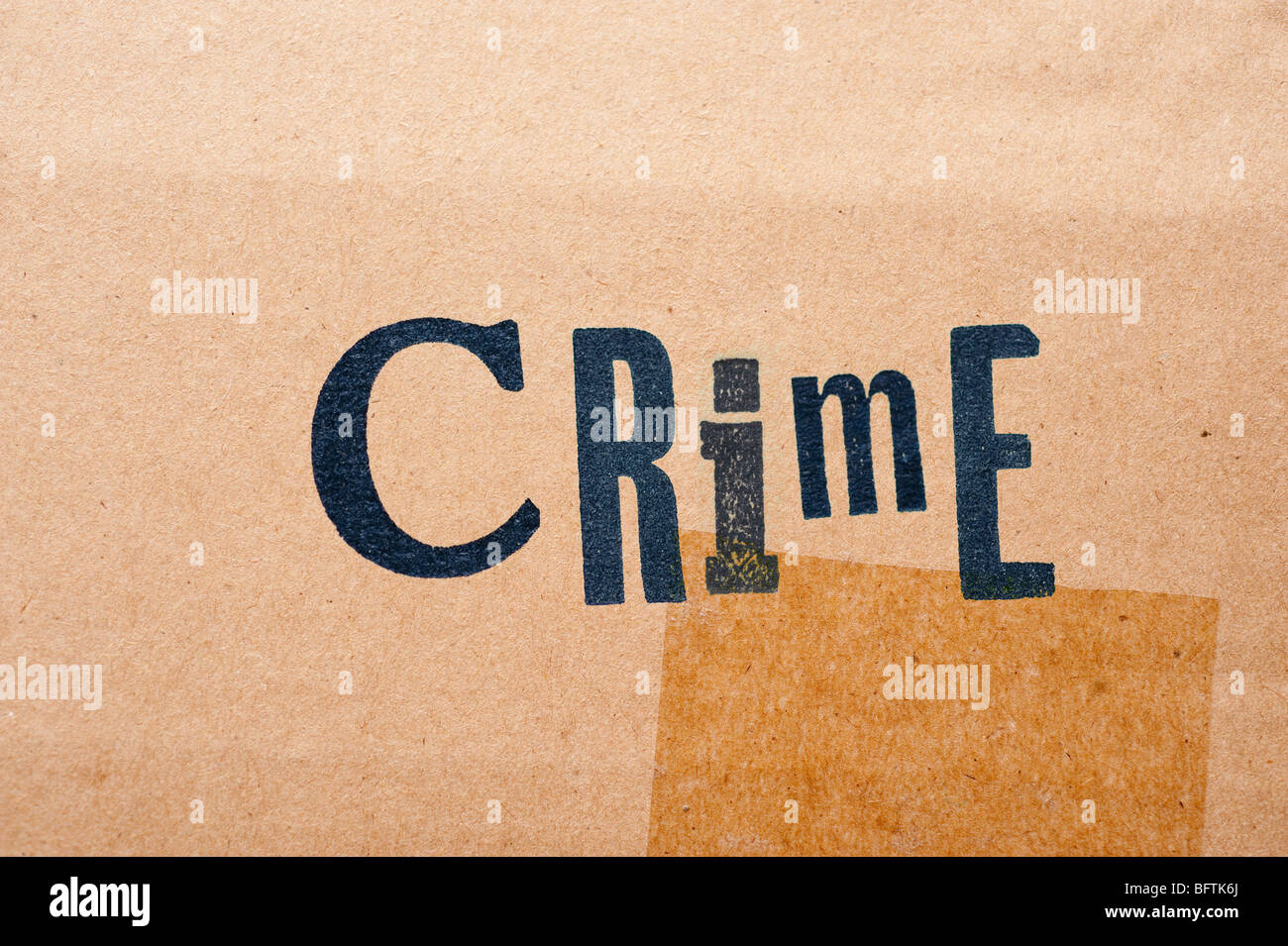 Crime, lettering on brown textured background Stock Photo - Alamy