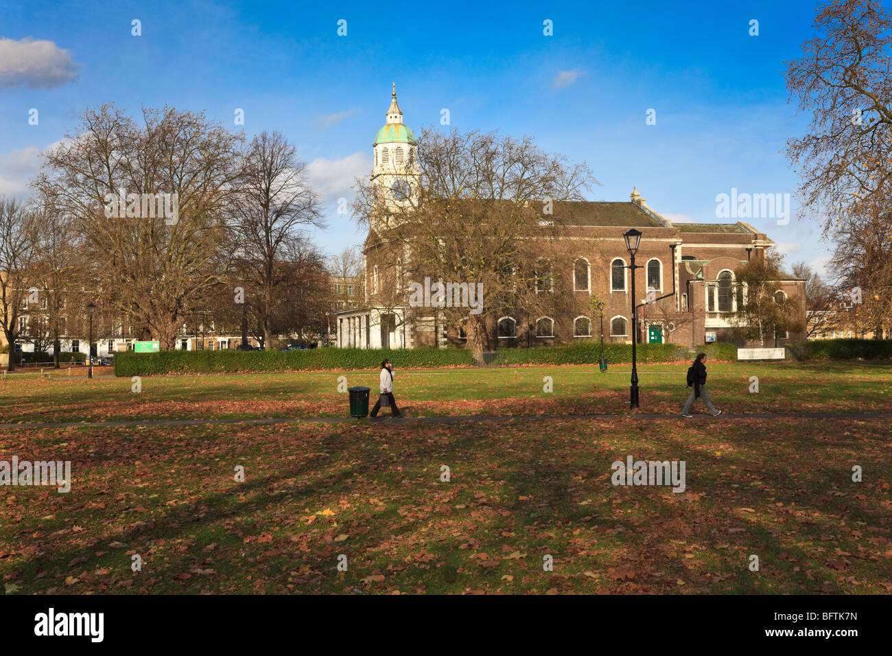 Women walk past the Church of the Holy Trinity, Clapham Common North ...