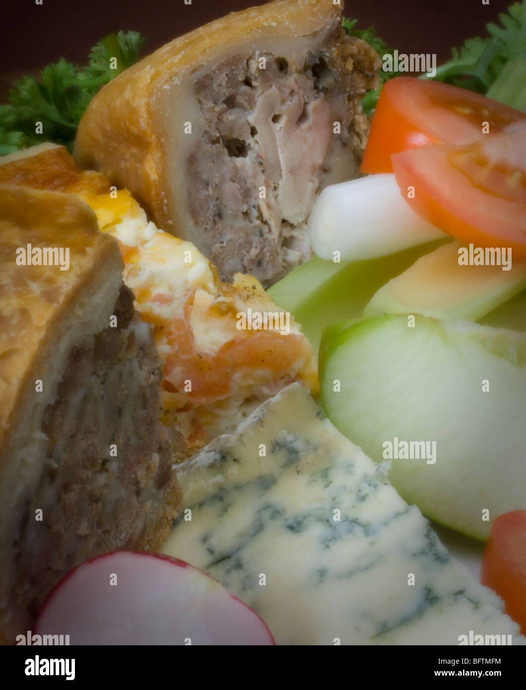 Close-up of Ploughmans Lunch with Pork Pie & Huntsman's Pie also blue ...