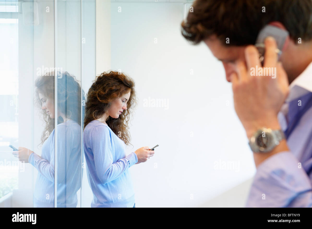 Business man and woman on the phone Stock Photo - Alamy