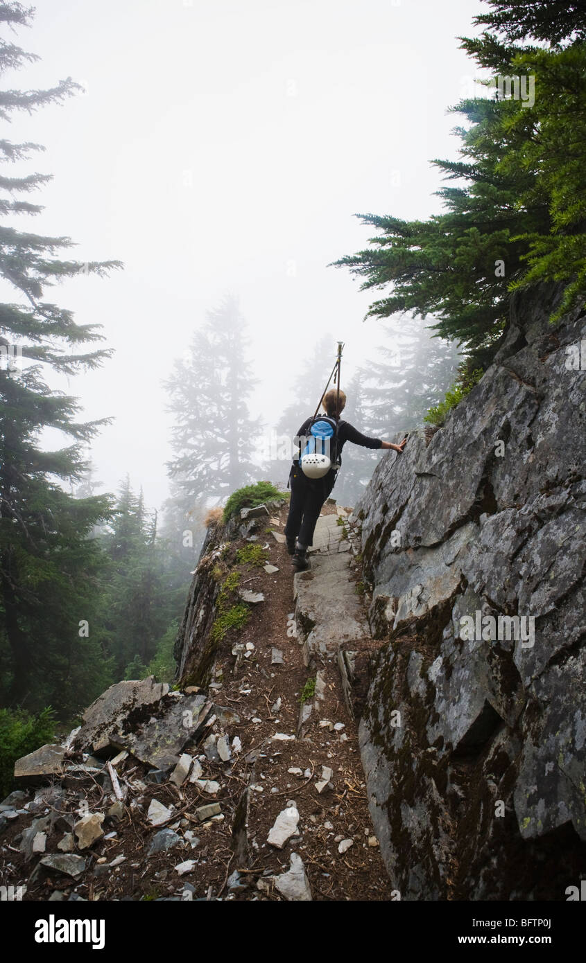 Man on cliff ledge hi-res stock photography and images - Alamy