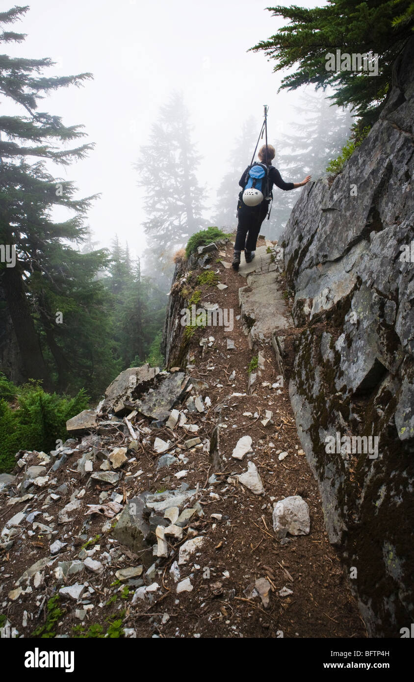 Man on cliff ledge hi-res stock photography and images - Alamy