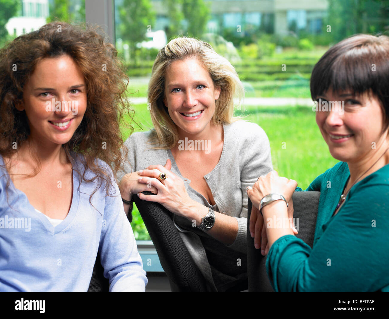 Smiling mature women posing camera hi-res stock photography and images ...