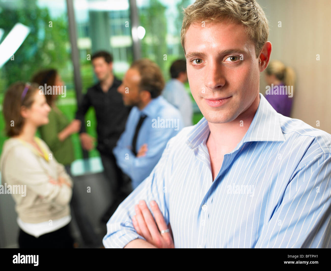 Business man in the office, smiling Stock Photo - Alamy