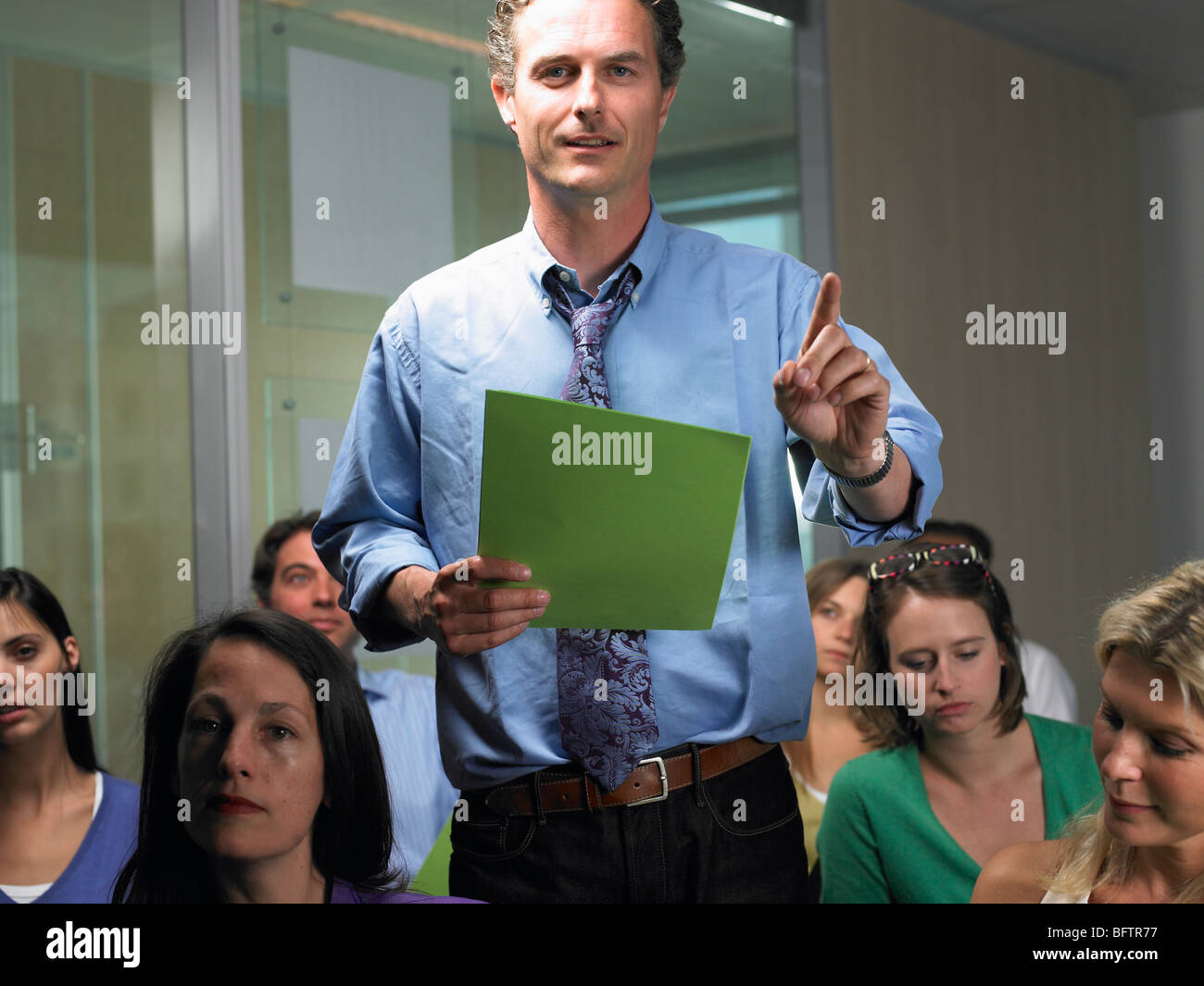 Man standing, asking a question Stock Photo - Alamy