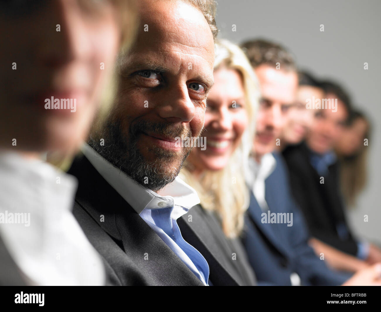 People looking at camera at a conference Stock Photo - Alamy