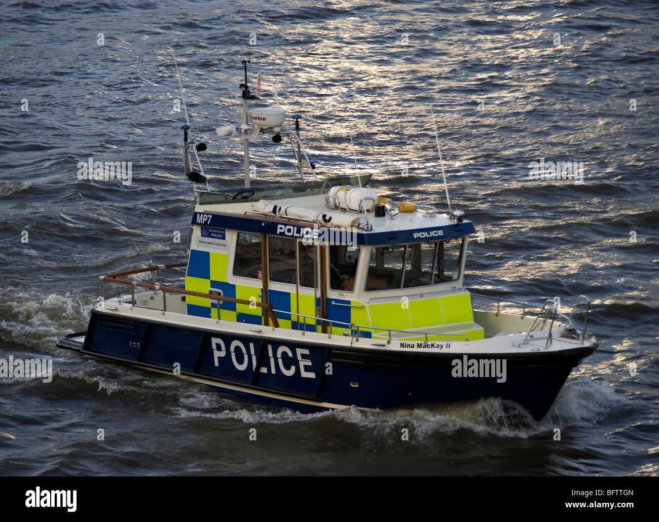 A police launch patrolling on the Thames near Blackfriars Bridge ...