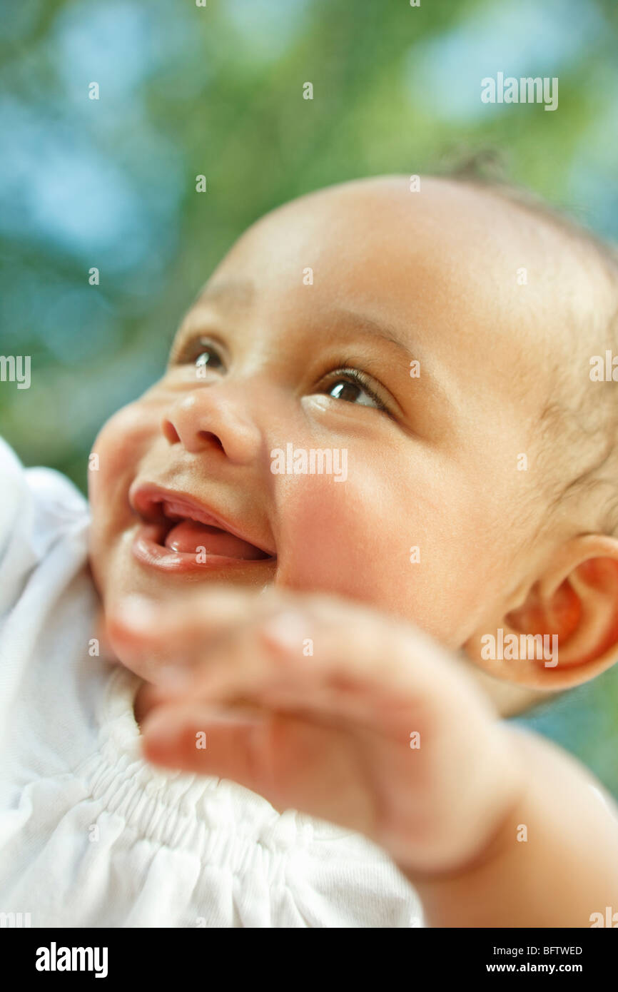 Baby smiling and playing Stock Photo - Alamy