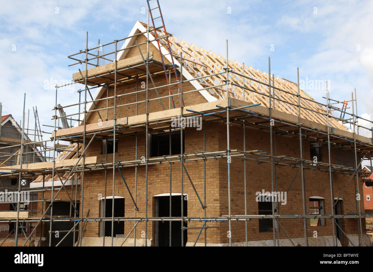 New houses under construction on a building site Stock Photo - Alamy