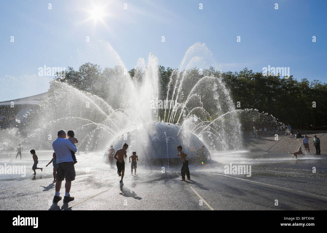 People playing in and around The International Fountain in the Seattle ...