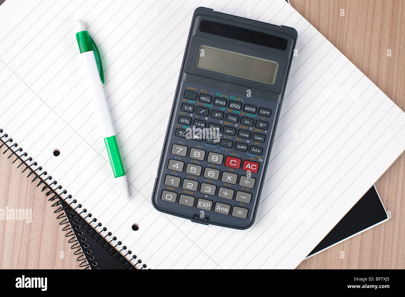 calculator,pen and notebook on table Stock Photo - Alamy