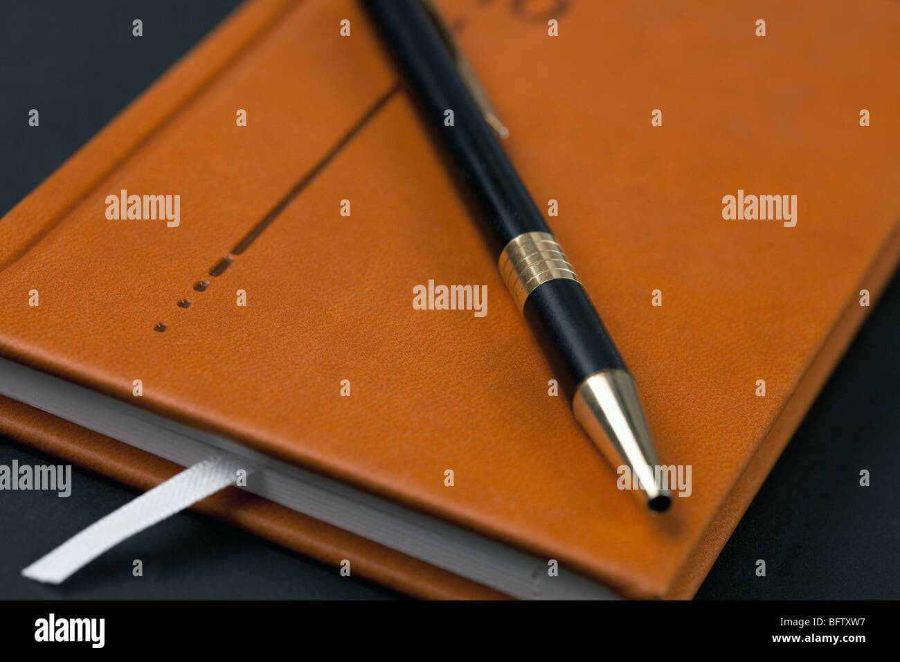the brown diary and pen Stock Photo - Alamy