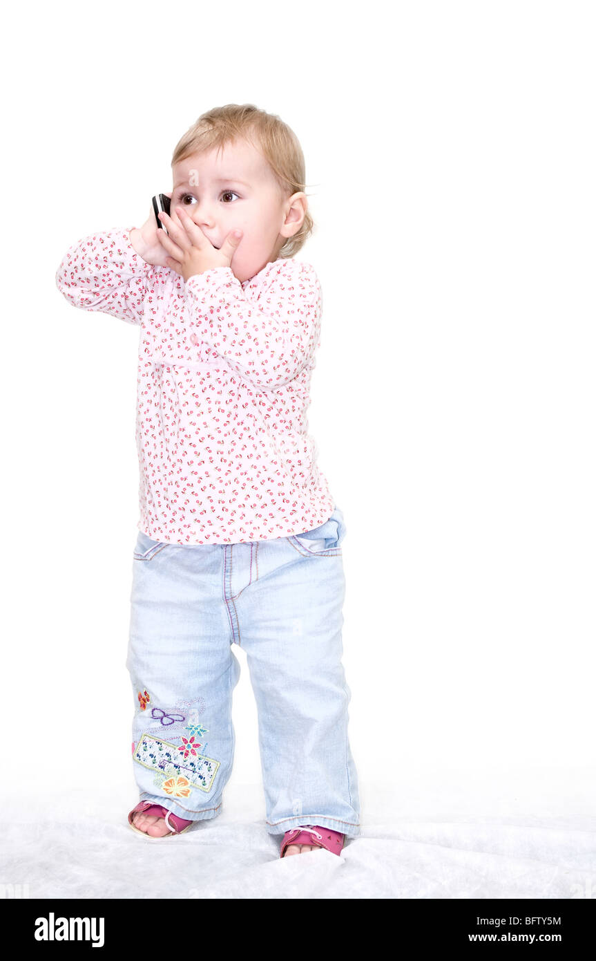 Cut child speaking by mobile phone. Isolated on white without flour ...