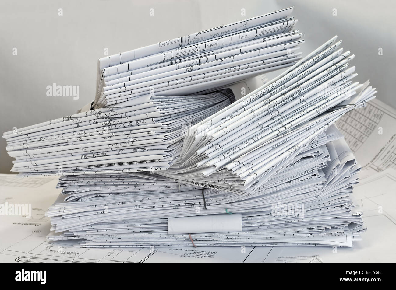 Stack of design drawings lies on table Stock Photo - Alamy