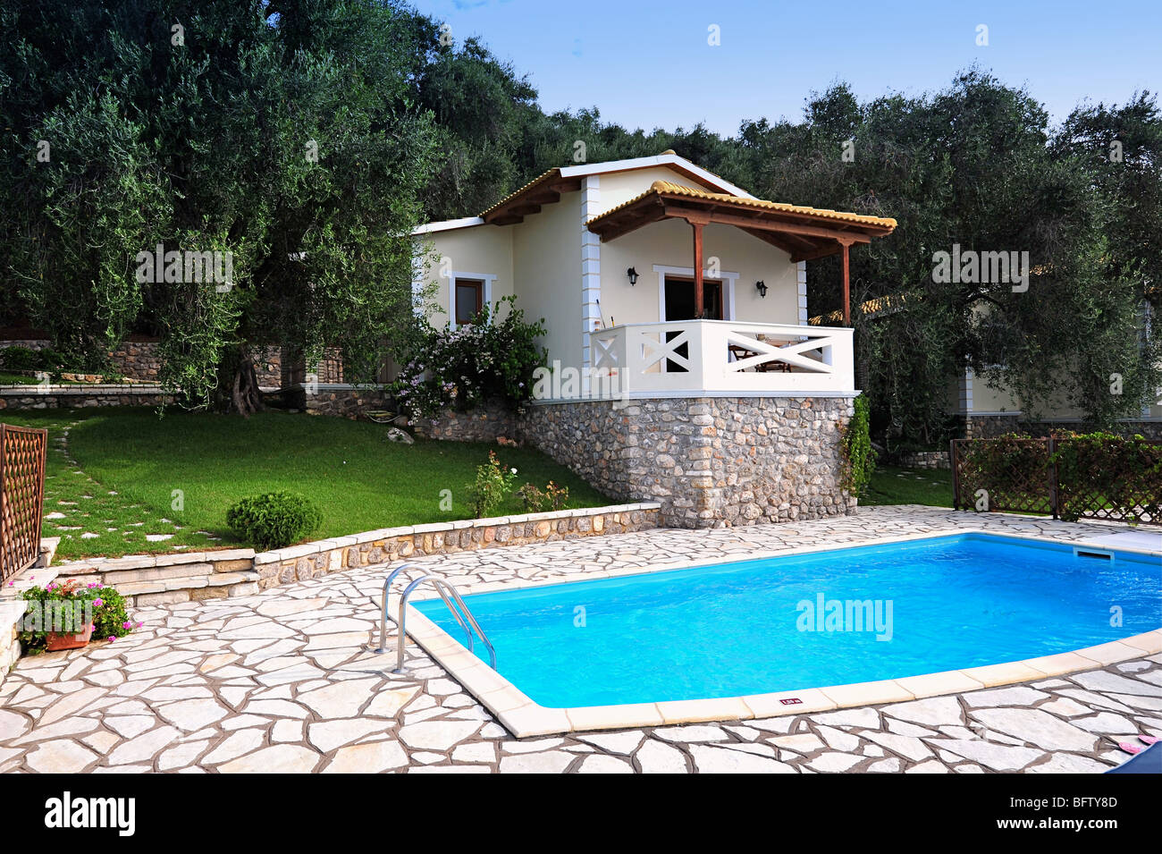 Holiday vacation villa exterior view with a private swimming pool ...