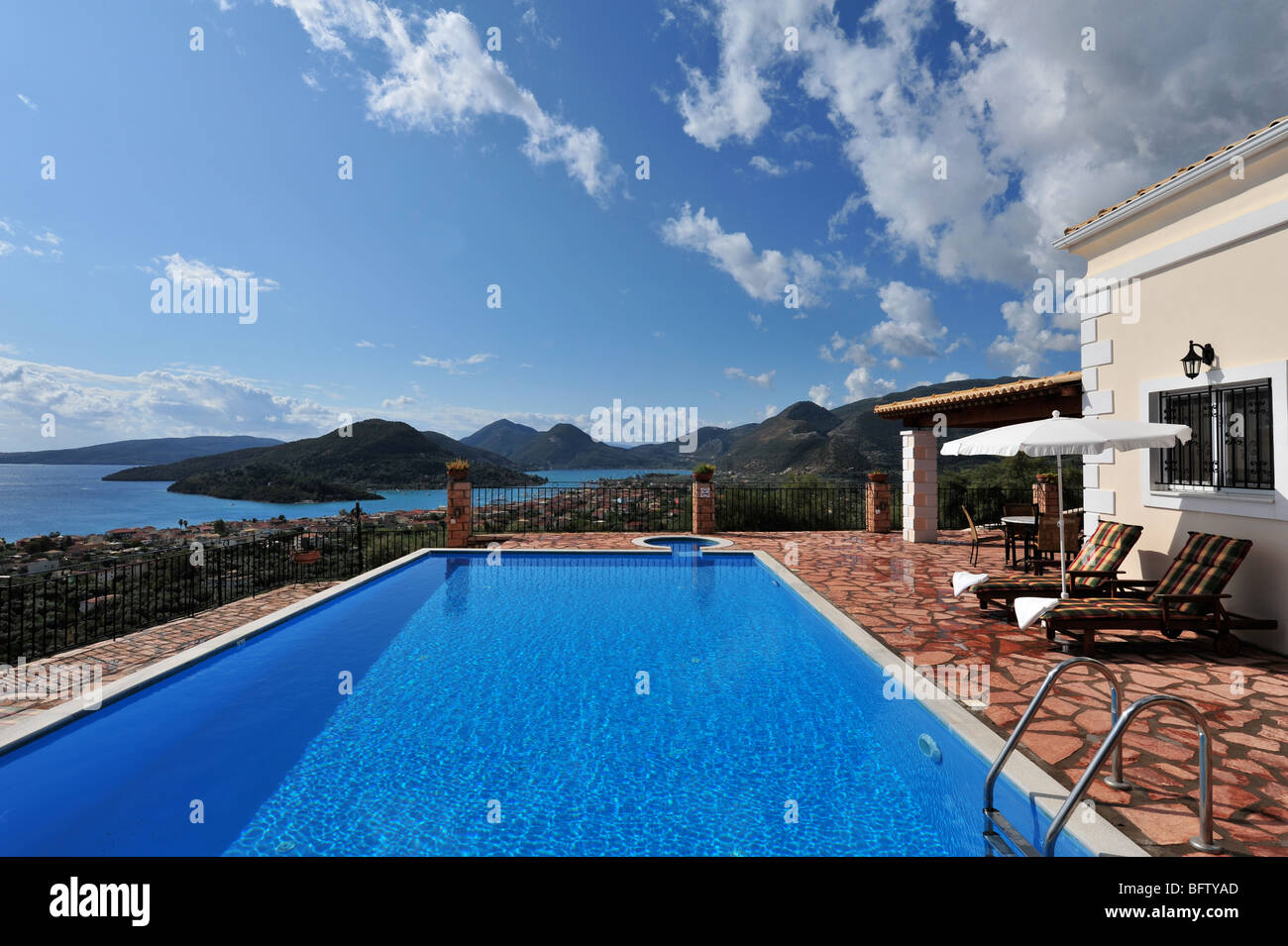 Holiday vacation villa exterior view with a private swimming pool and a ...