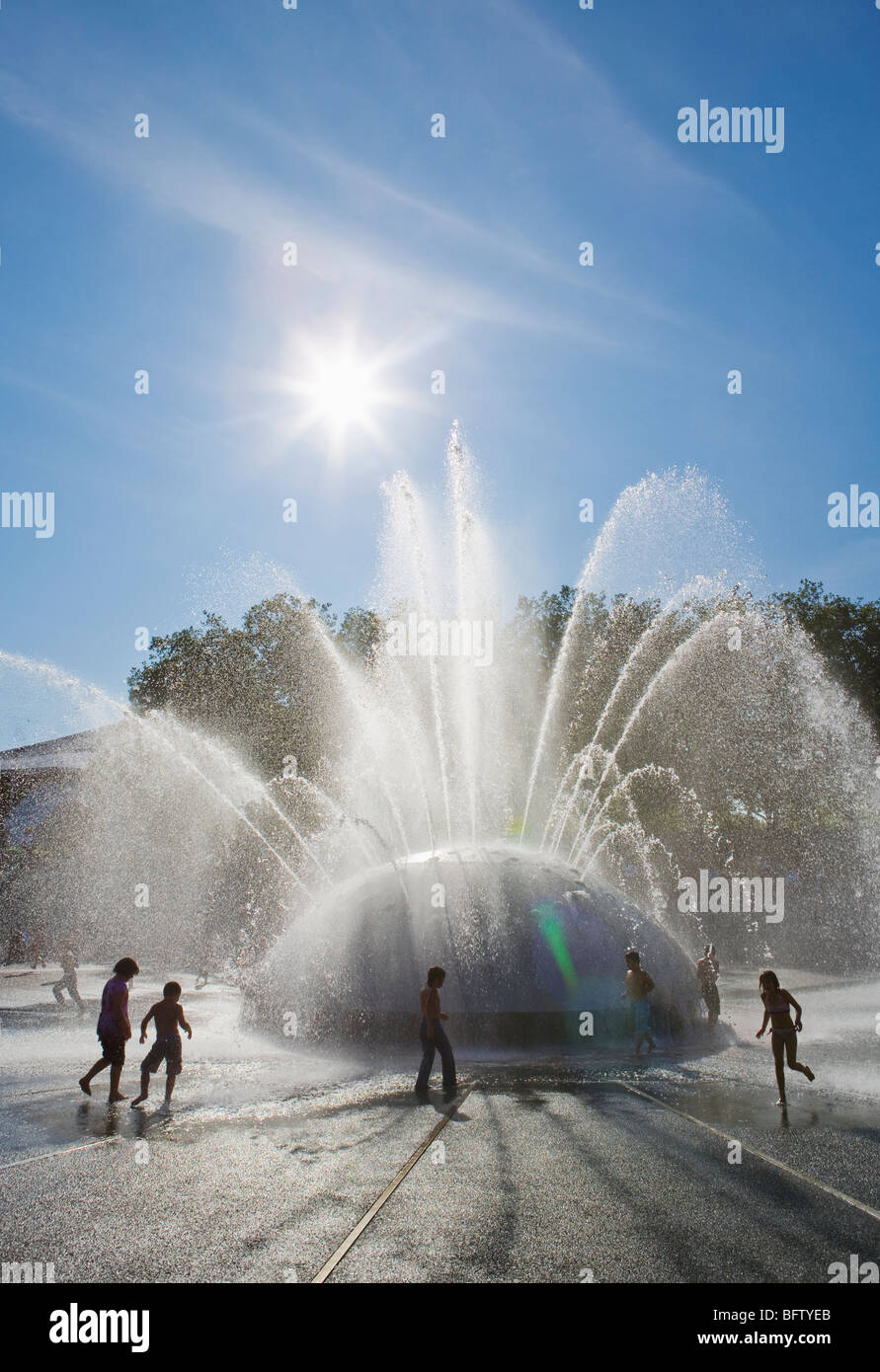 People playing in and around The International Fountain in the Seattle ...