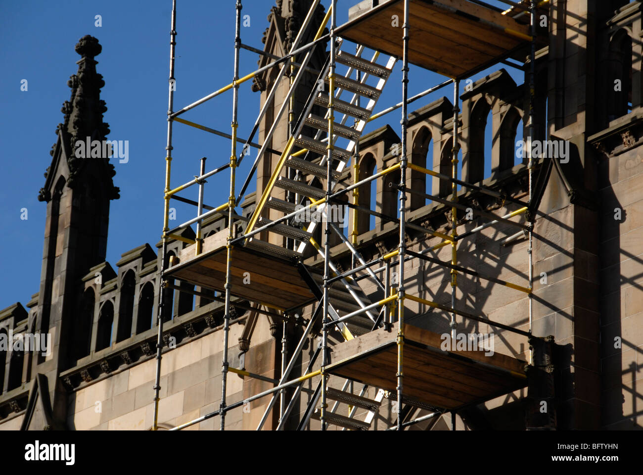 Scaffolding for repairs to a stone church in Edinburgh Stock Photo - Alamy