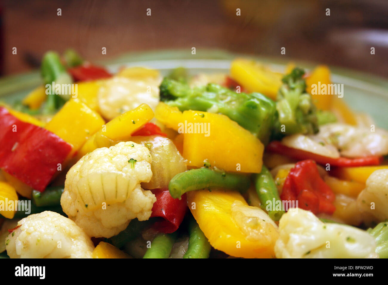 Hot vegetables directly from the wok pan Stock Photo - Alamy