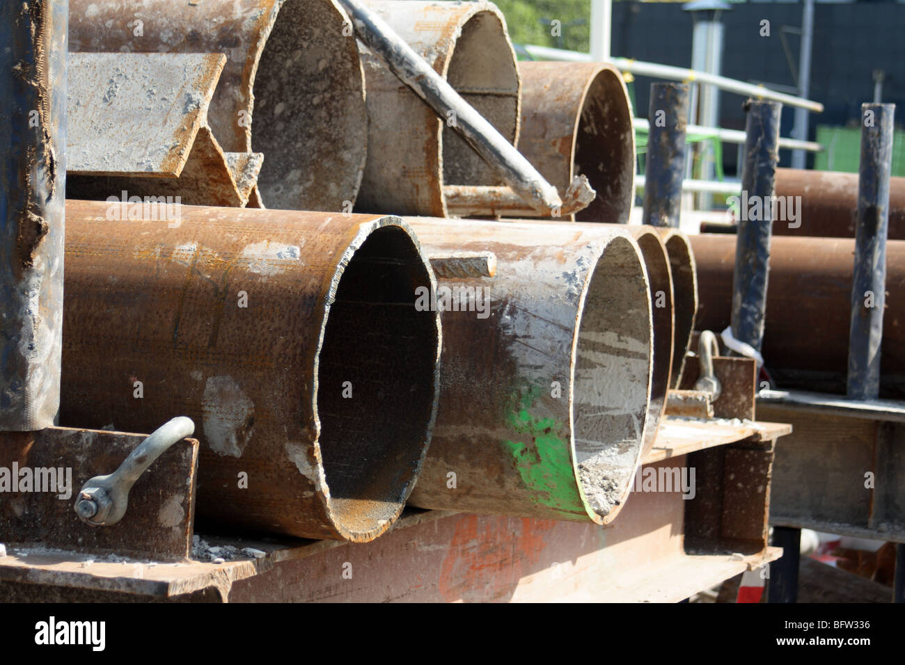 Rusty pipes on a construction site just waiting Stock Photo - Alamy