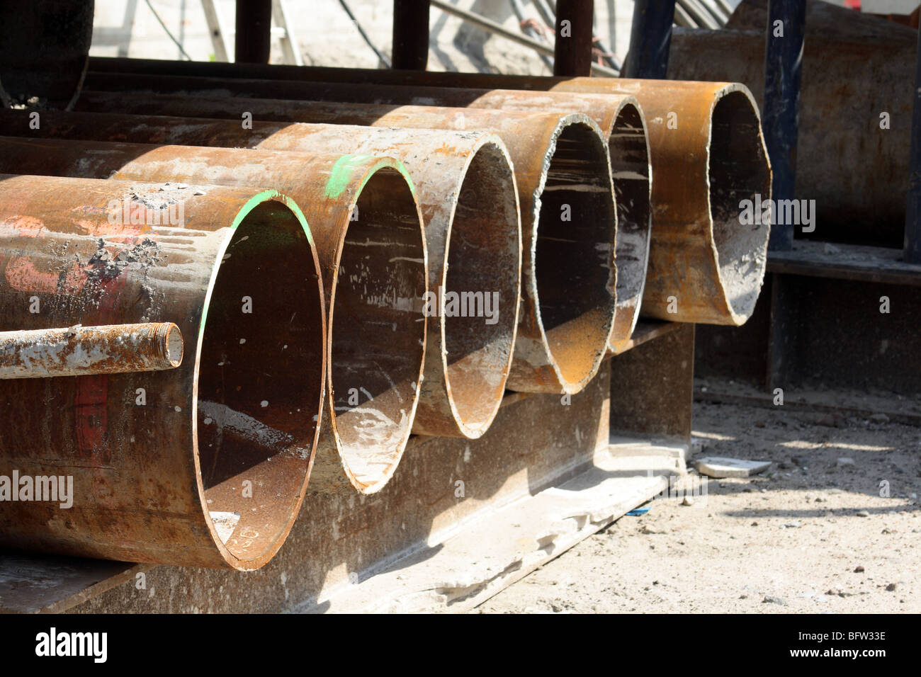 Rusty pipes on a construction site just waiting Stock Photo - Alamy