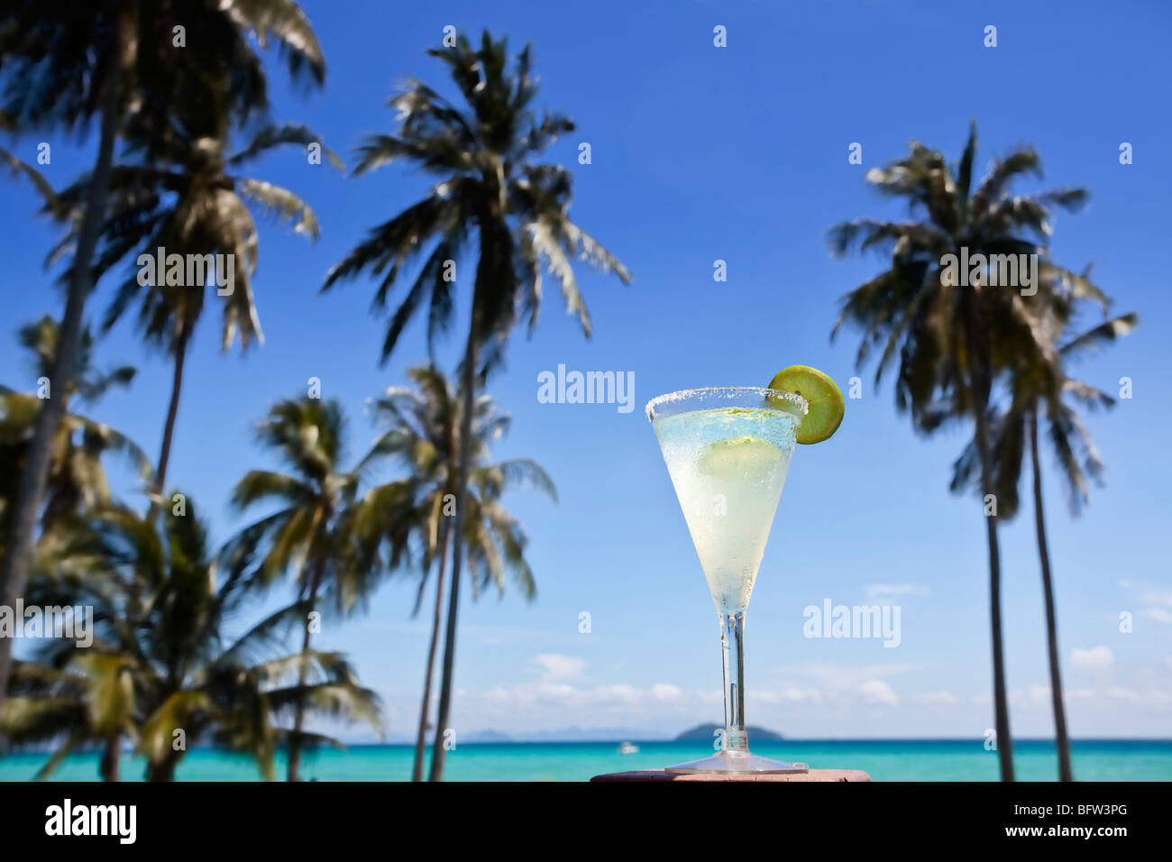 Margarita cocktail with a swimming pool in the background Stock Photo ...