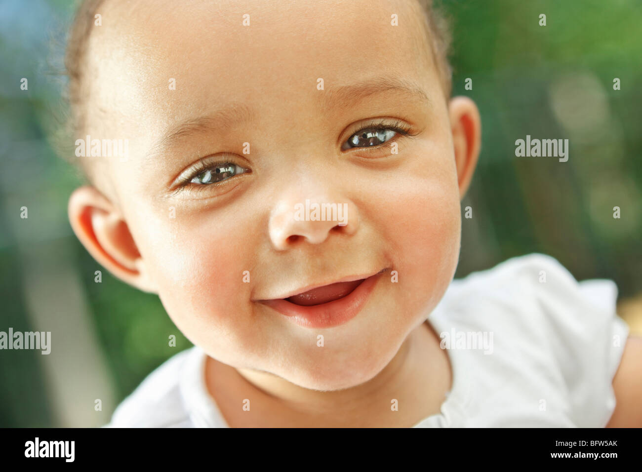 Baby smiling at camera Stock Photo - Alamy